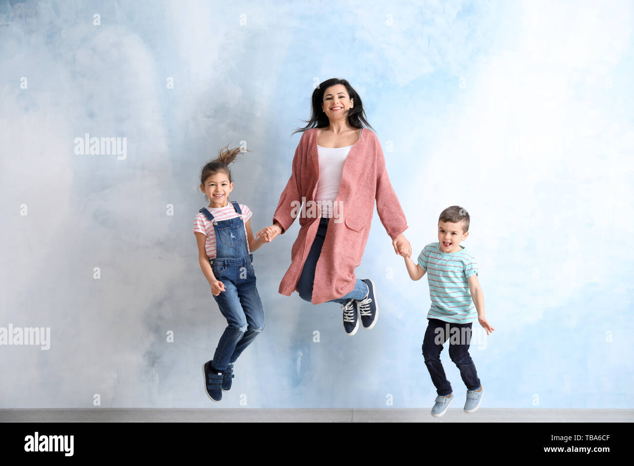 Happy jumping family hi-res stock photography and images - Alamy