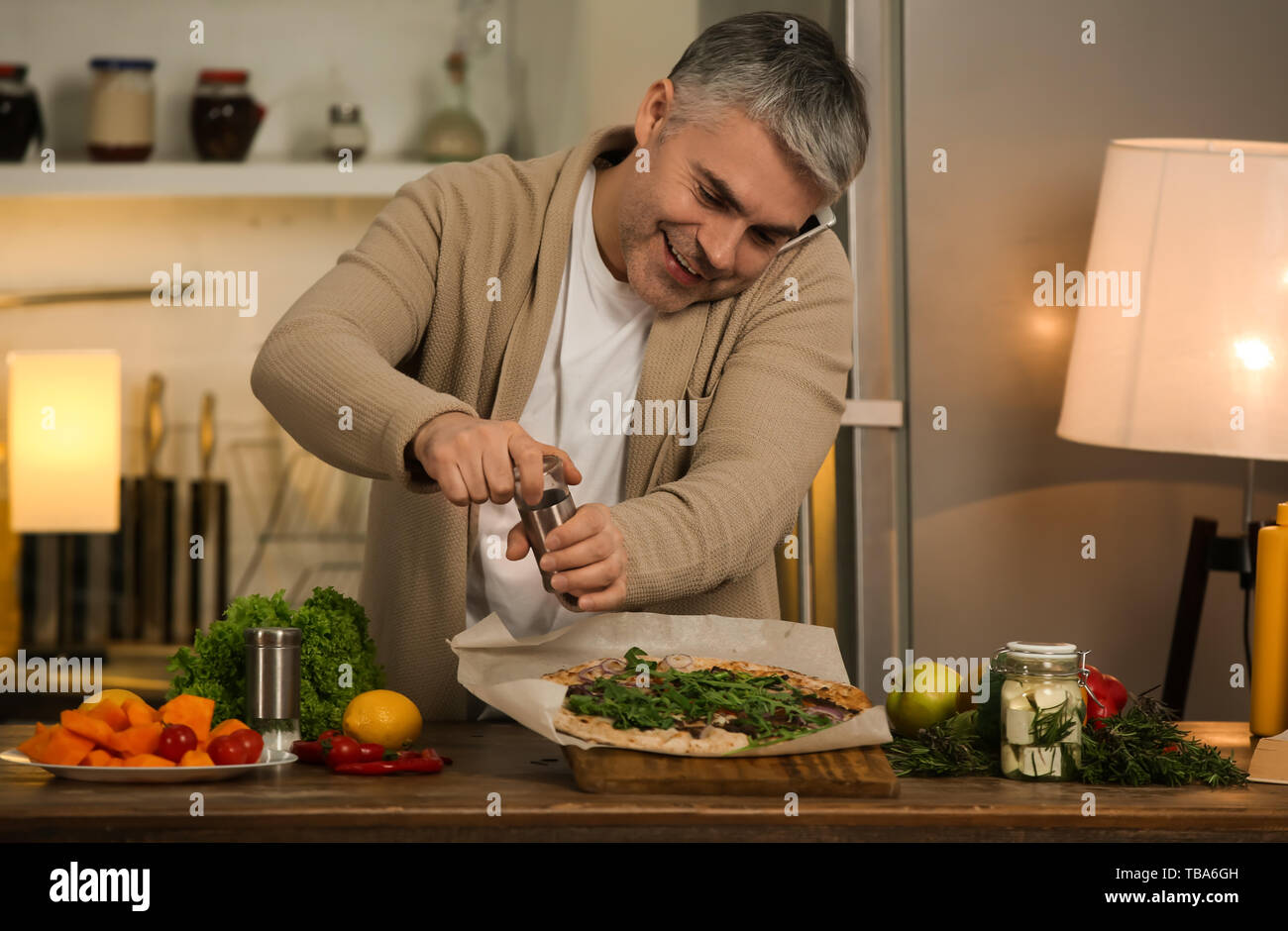 Italian mature man talking mobile hi-res stock photography and images ...