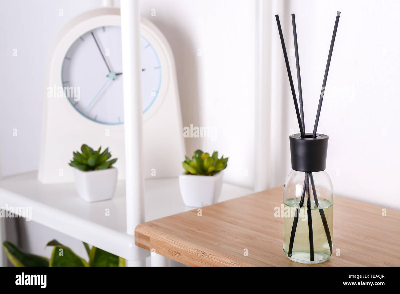 Reed diffuser on shelf in room Stock Photo - Alamy