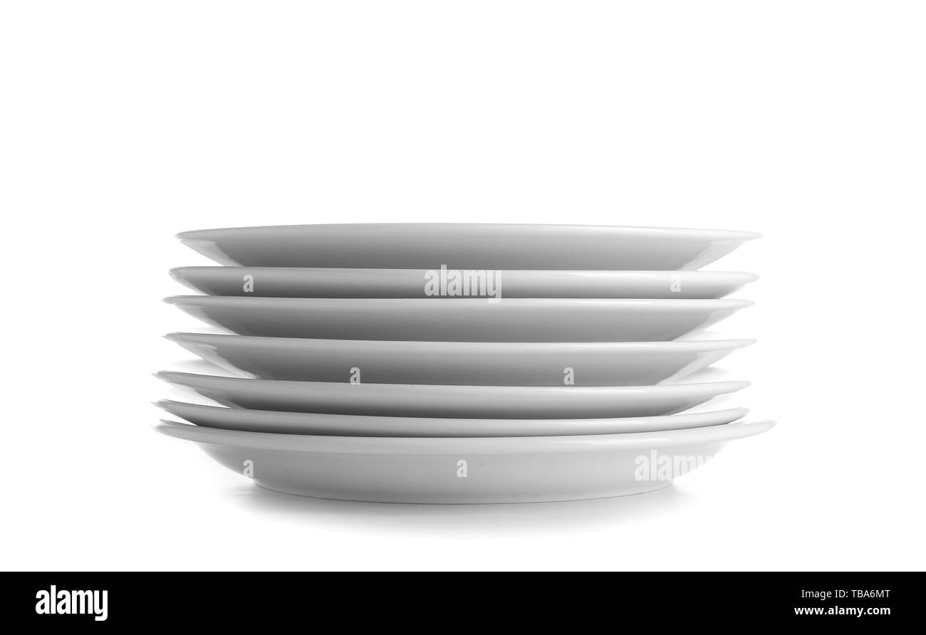 Stack of clean plates on white background Stock Photo - Alamy