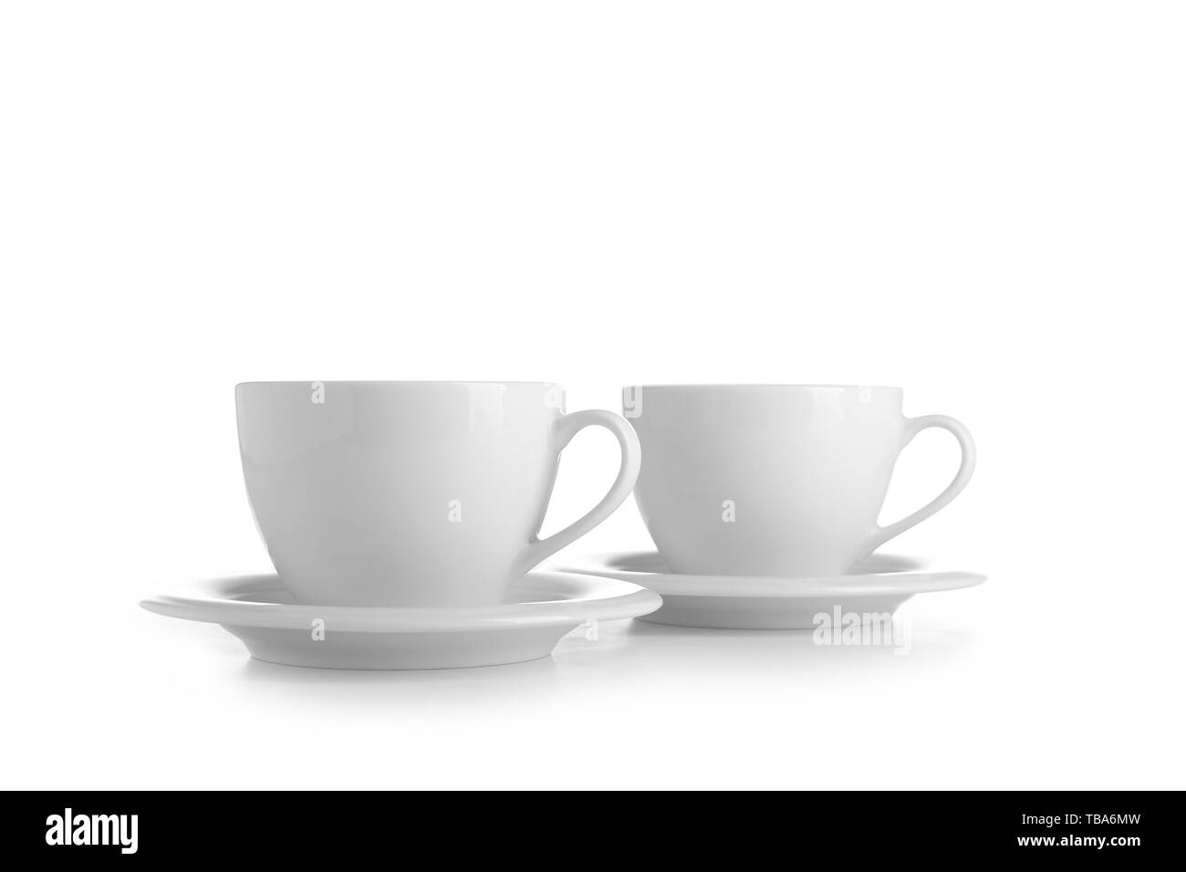 Clean cups on white background Stock Photo - Alamy