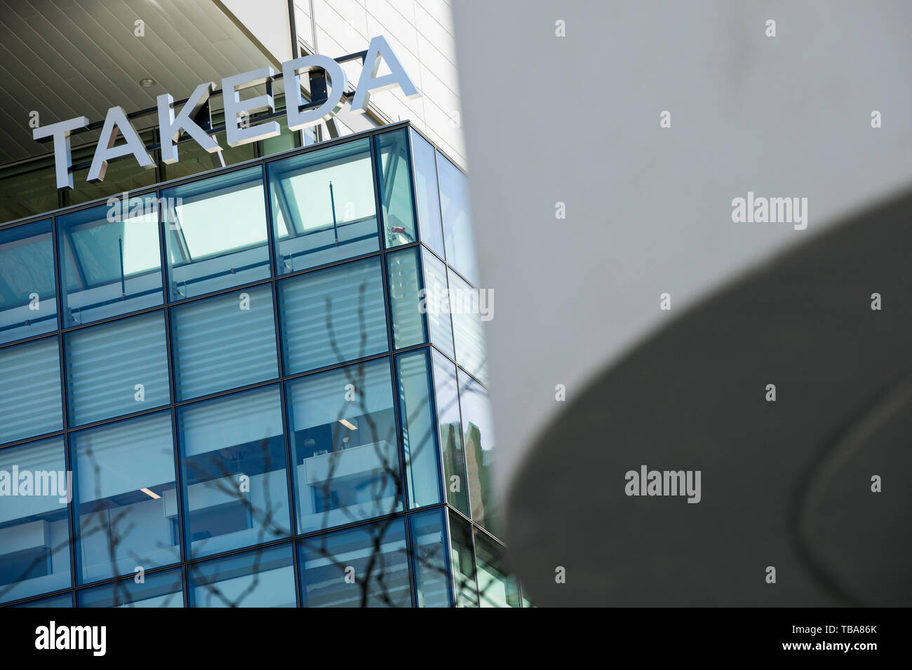 A logo sign outside of a facility occupied by the Takeda Pharmaceutical ...
