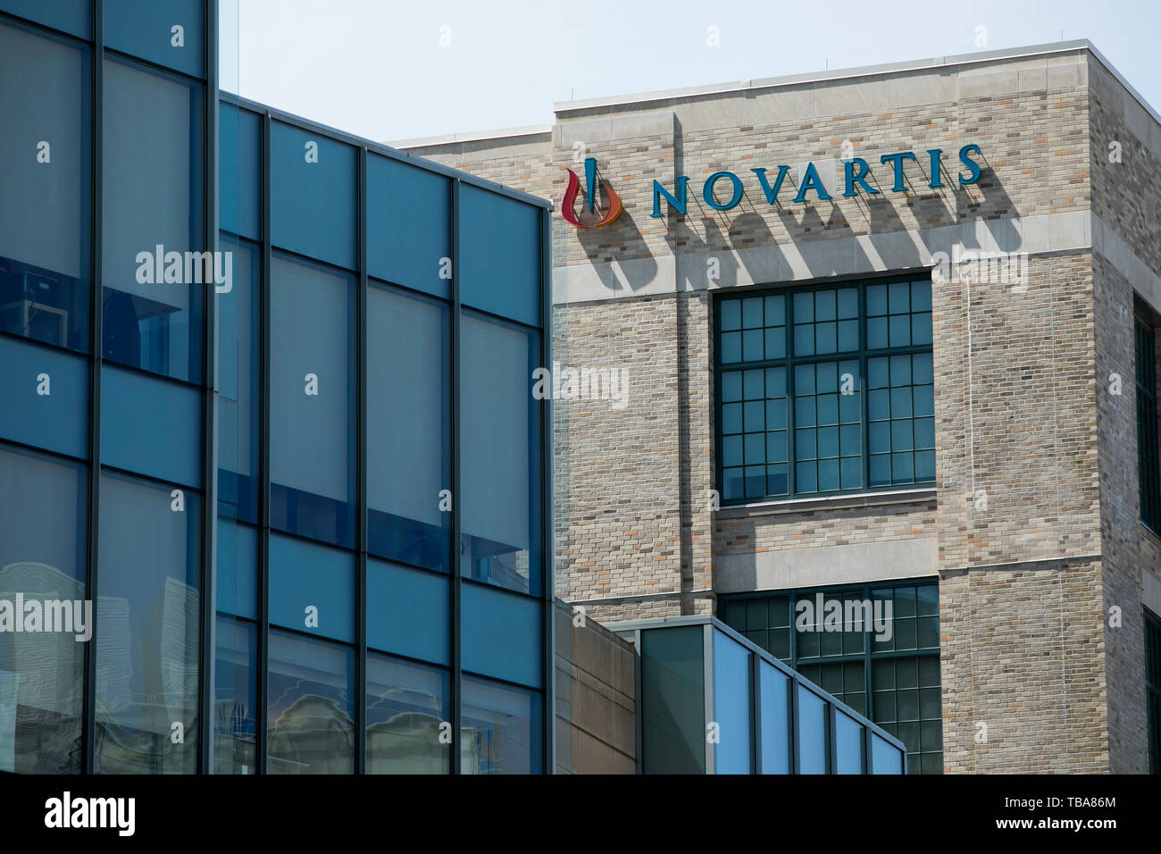 A logo sign outside of a facility occupied by Novartis International in ...