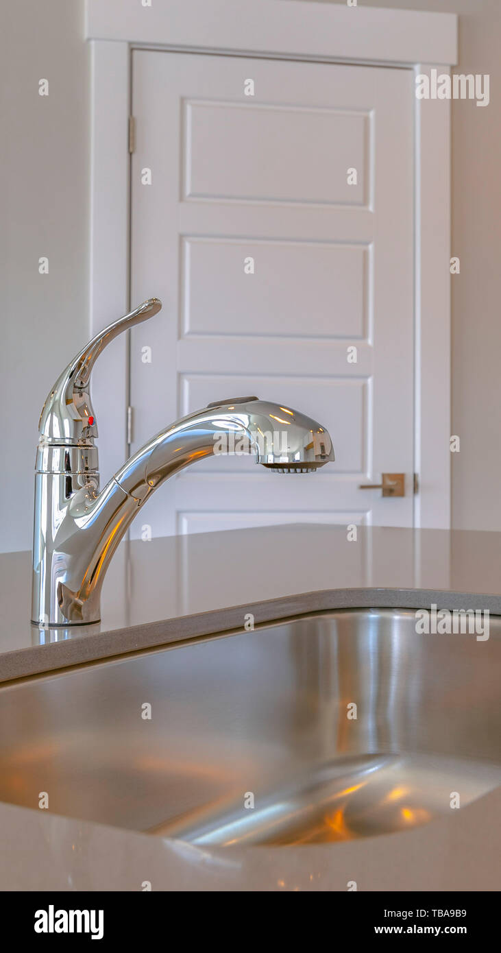 frame Vertical frame Shiny stainless steel sink and faucet on the ...