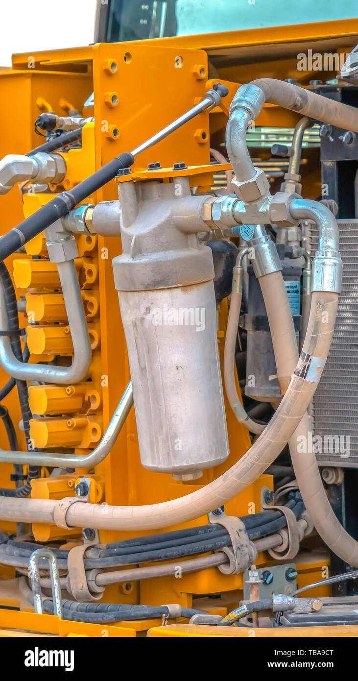 frame Vertical frame Close up of the engine of a yellow heavy duty ...