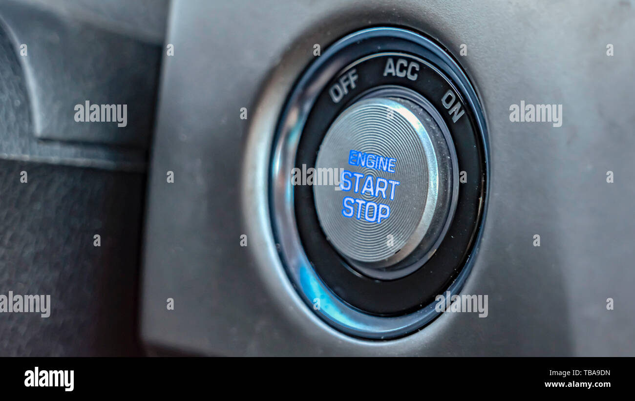 frame Panorama Close up view of an engine push start and stop button ...