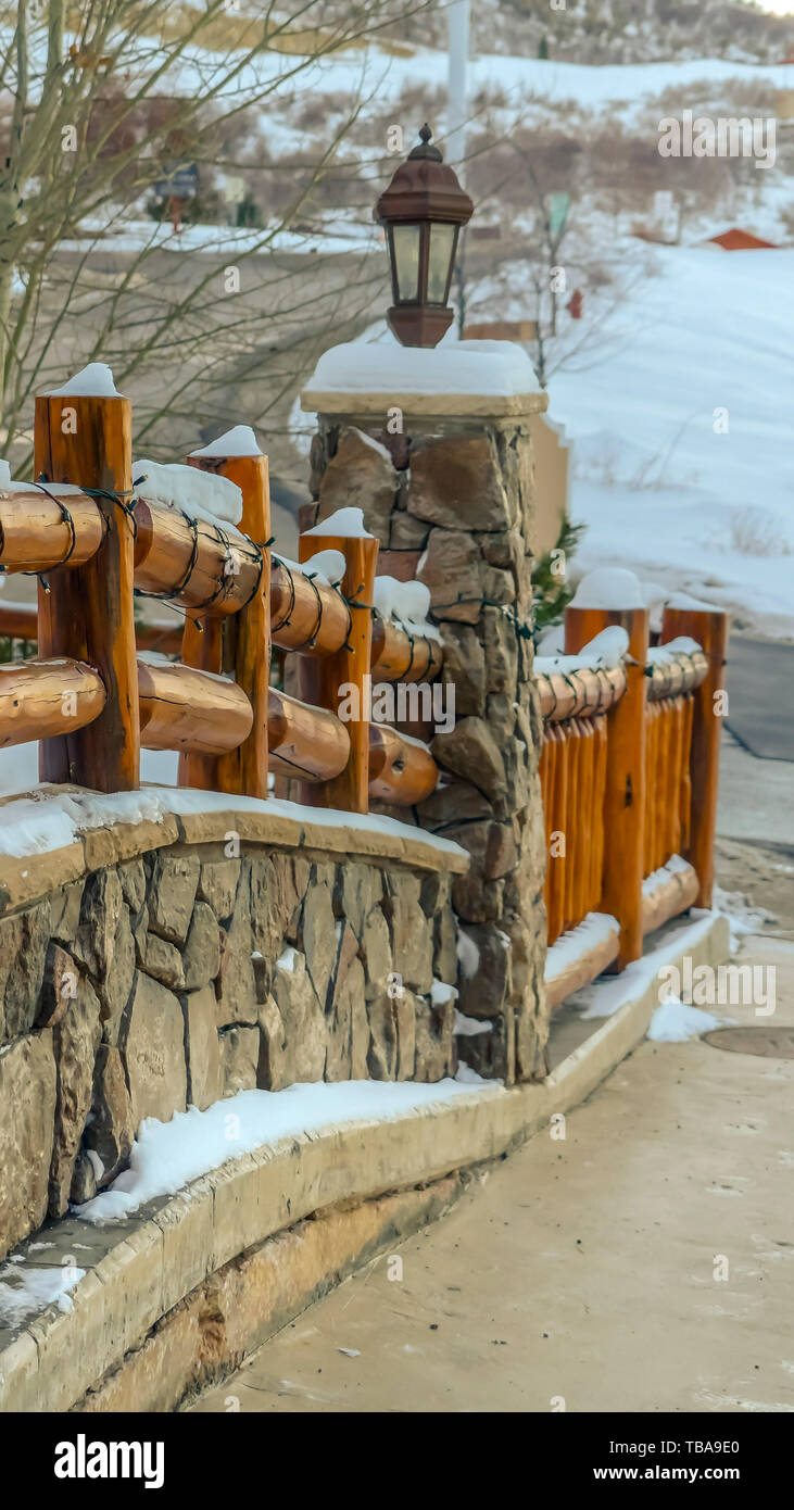 frame Vertical frame Building exterior with stone wall and wooden ...