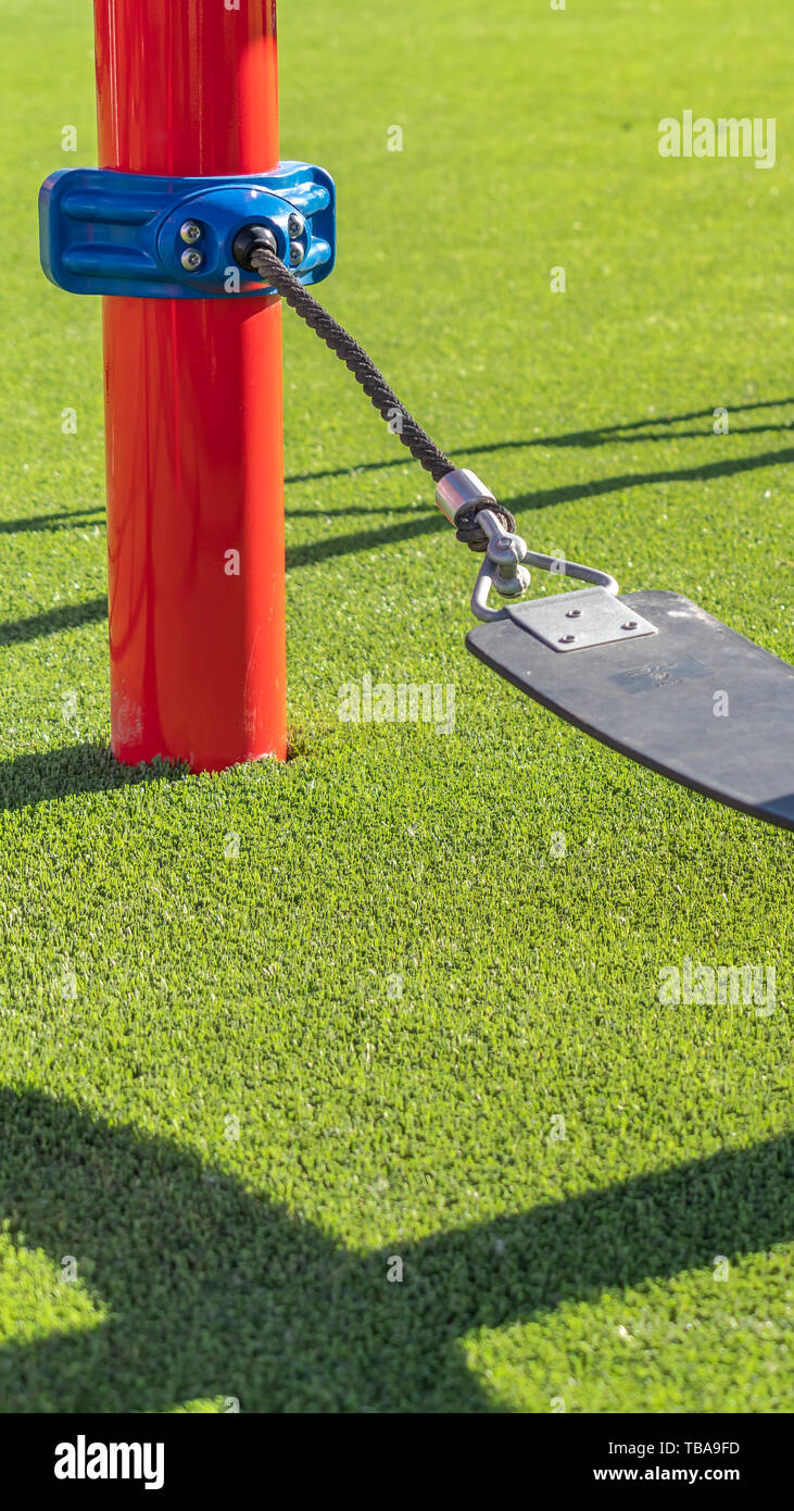 frame Vertical frame Play area with a seat supported by ropes that are ...