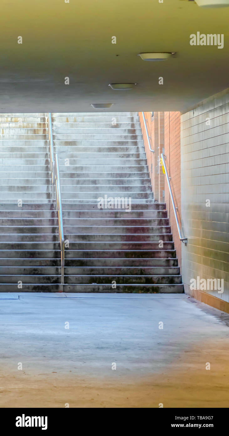 frame Vertical Wide flight of stairs at a passageway under a building ...