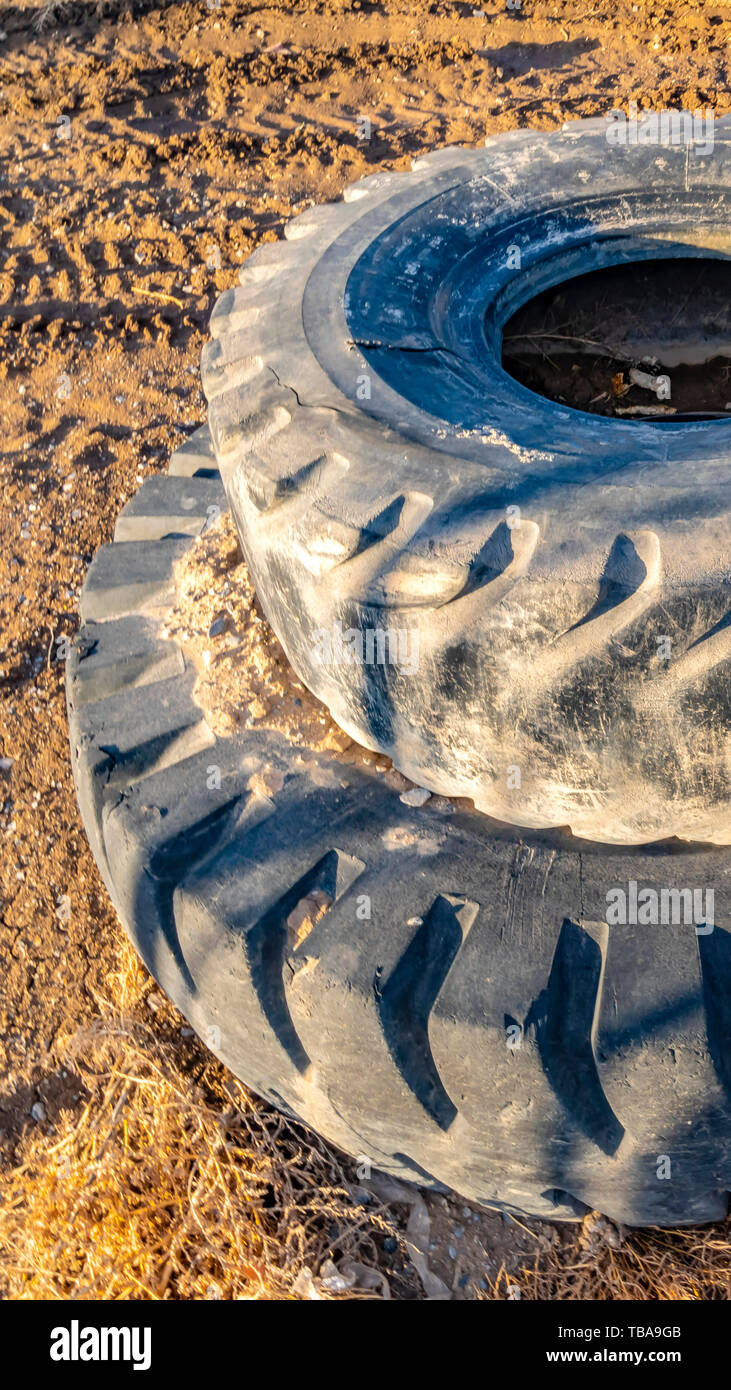 frame Vertical frame Old and dirty rubber tires stacked on top of each ...