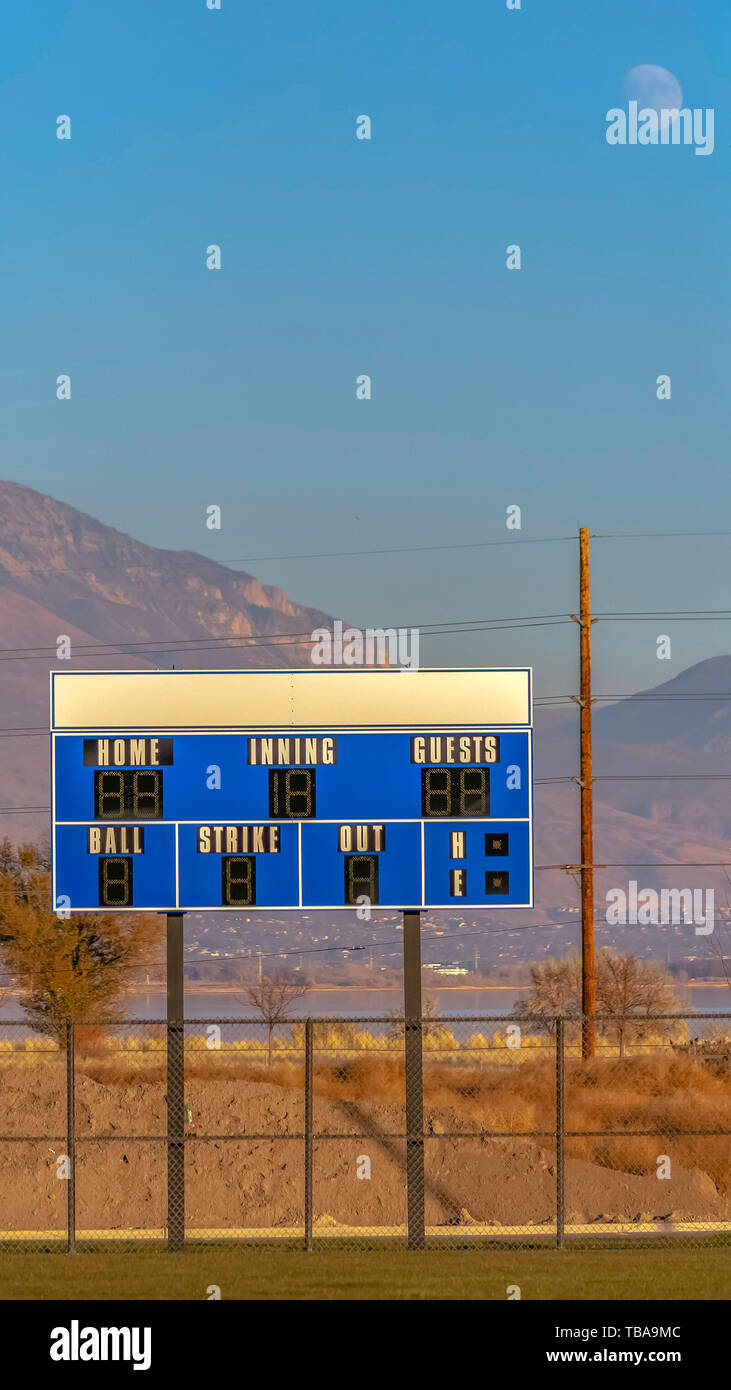 frame Vertical Blue and white electronic baseball scoreboard at a ...