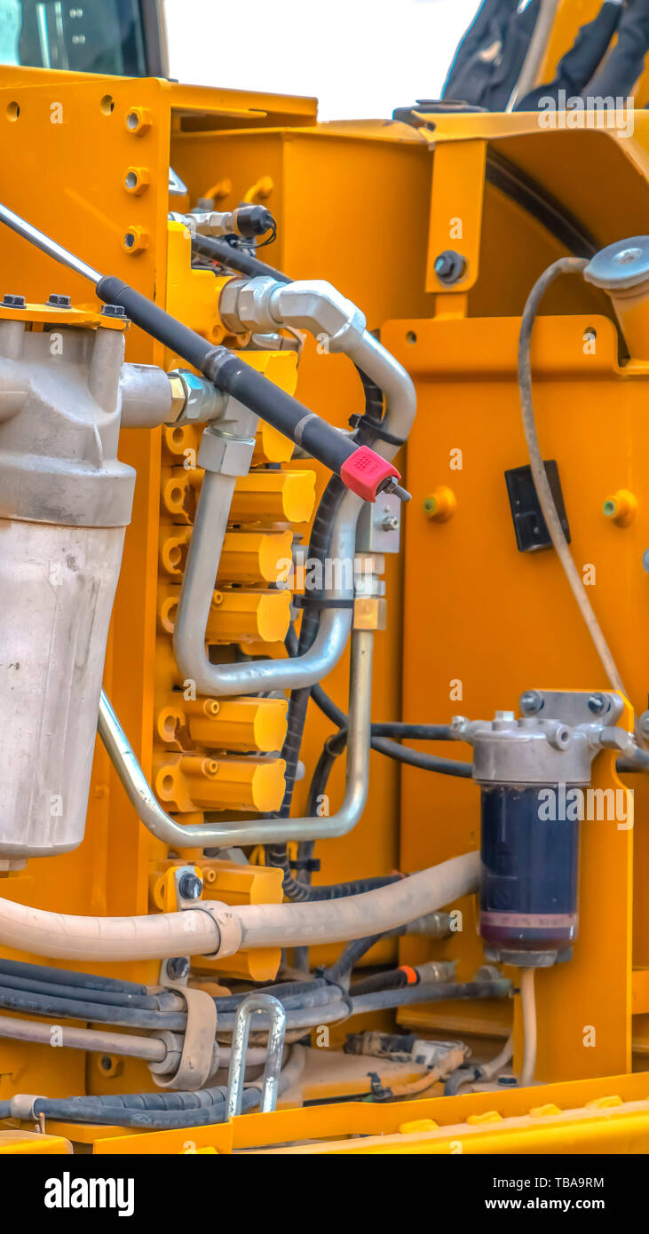 frame Vertical Close up of the engine of a yellow heavy duty ...