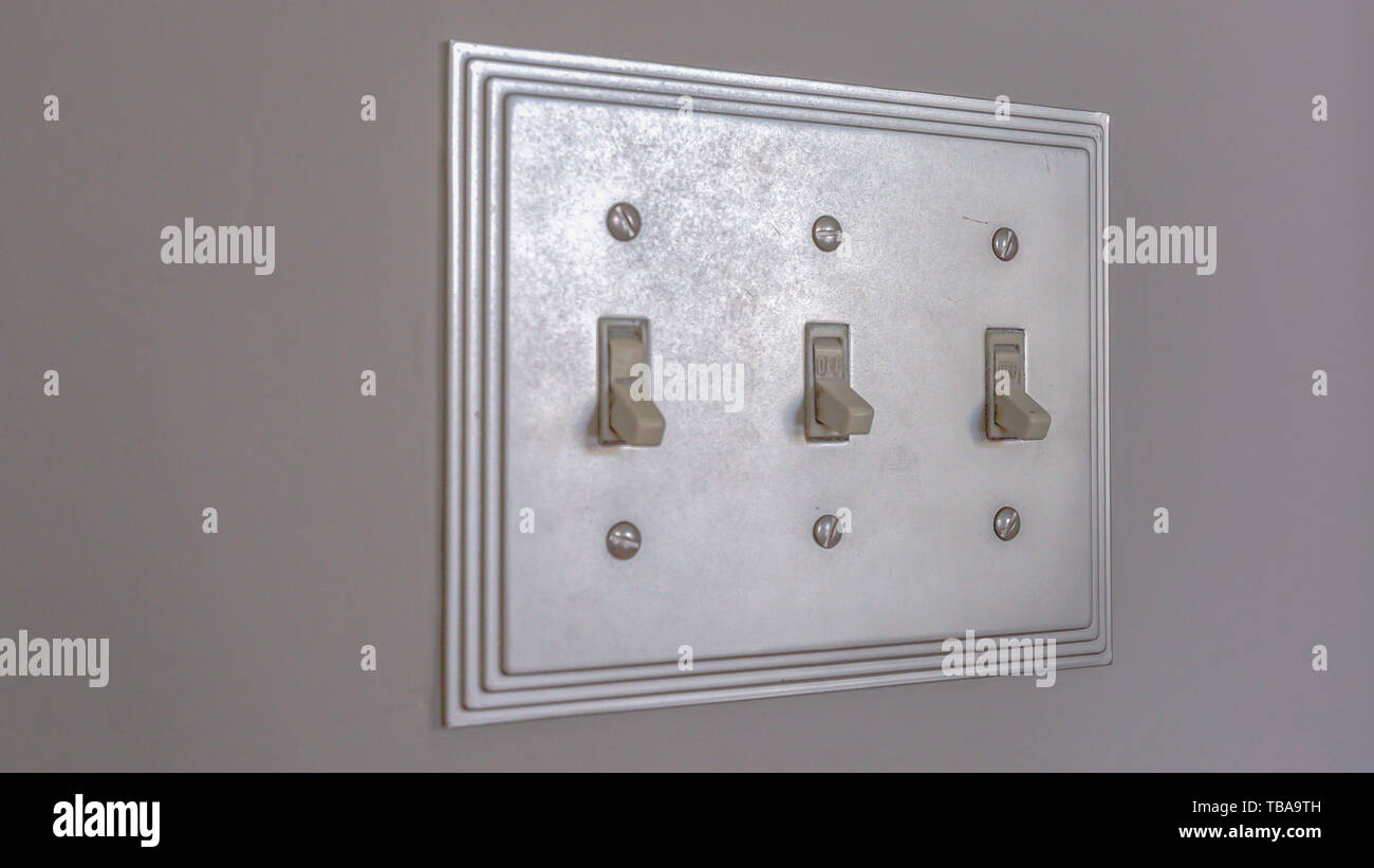 frame Panorama Close up of the wall mounted electrical light switch ...