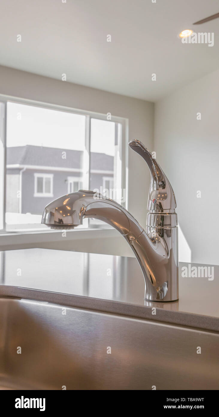 frame Vertical frame Shiny kitchen counter top with sink and faucet ...