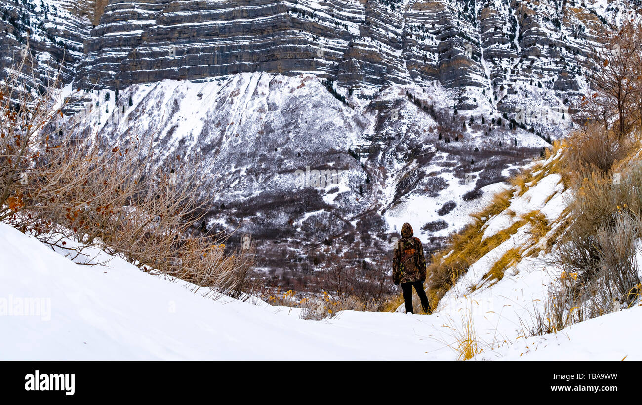 frame Panorama Man with a view of a majestic mountain covered with ...