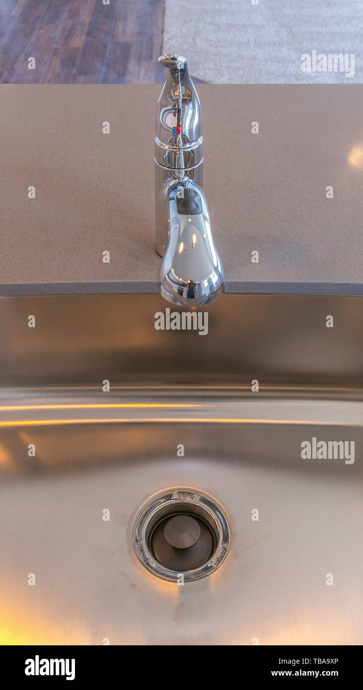 frame Vertical frame Shiny stainless steel sink and faucet on the ...