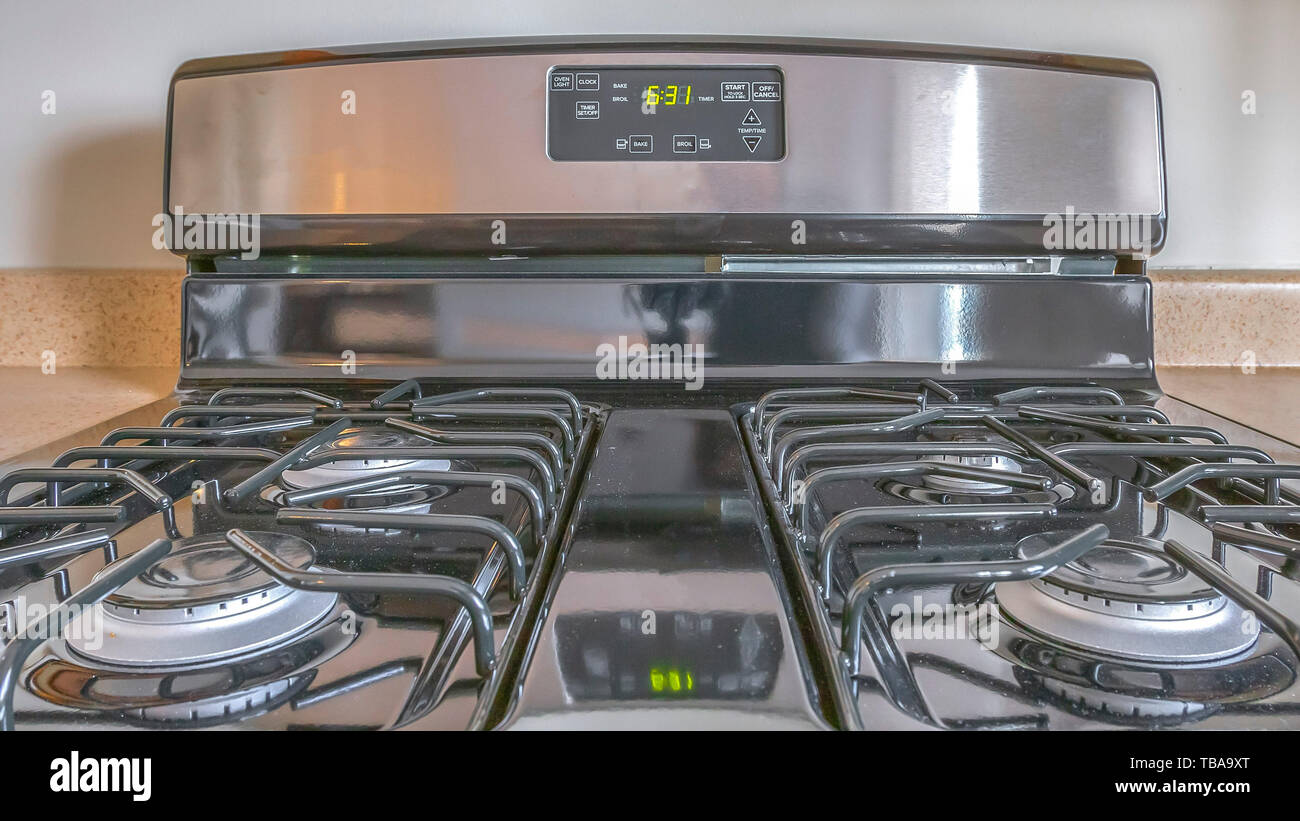 frame Panorama Close up of a gas stove with a shiny surface inside the ...