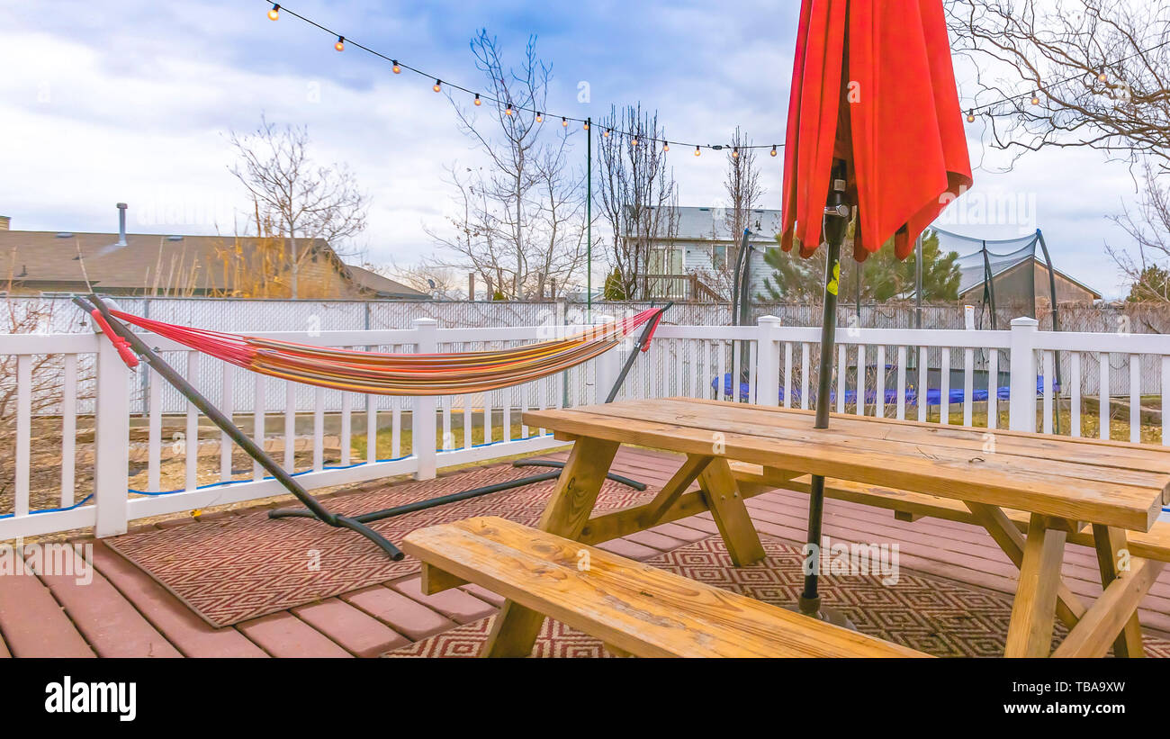 frame Panorama frame Wooden patio with white railing overlooking the ...