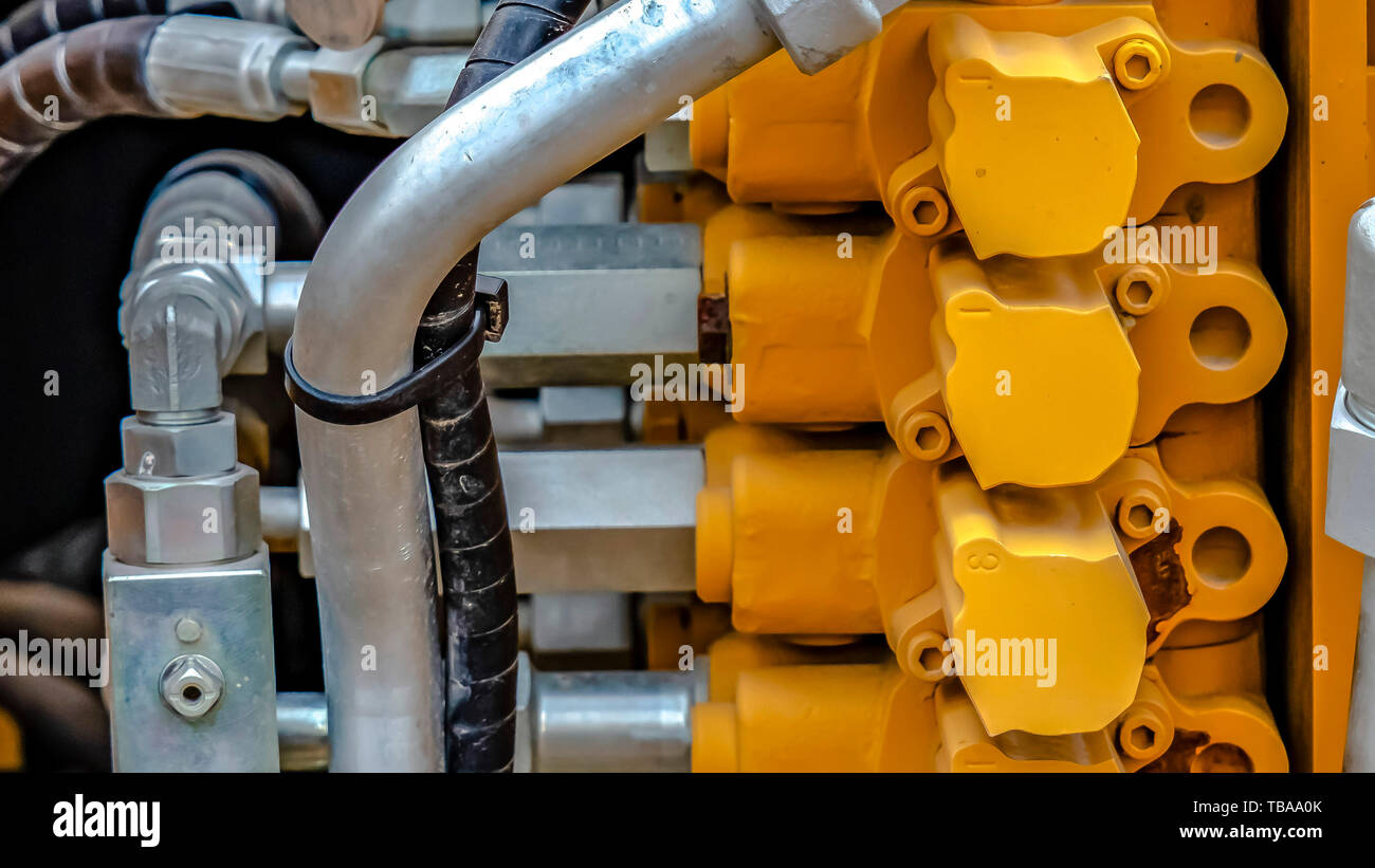 Panorama frame Details of a yellow construction machinery with close up ...
