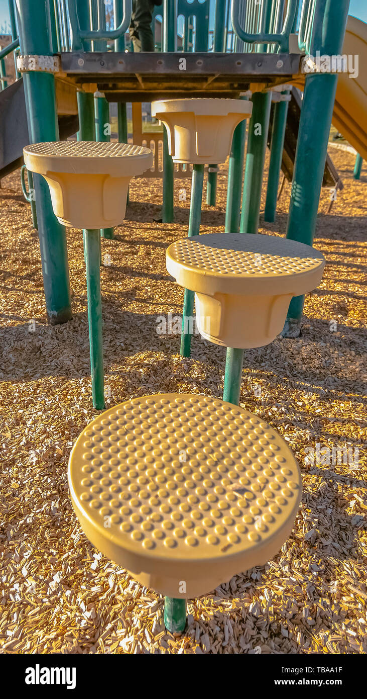 Vertical Circular steps and stairs going up the slide viewed on a sunny ...