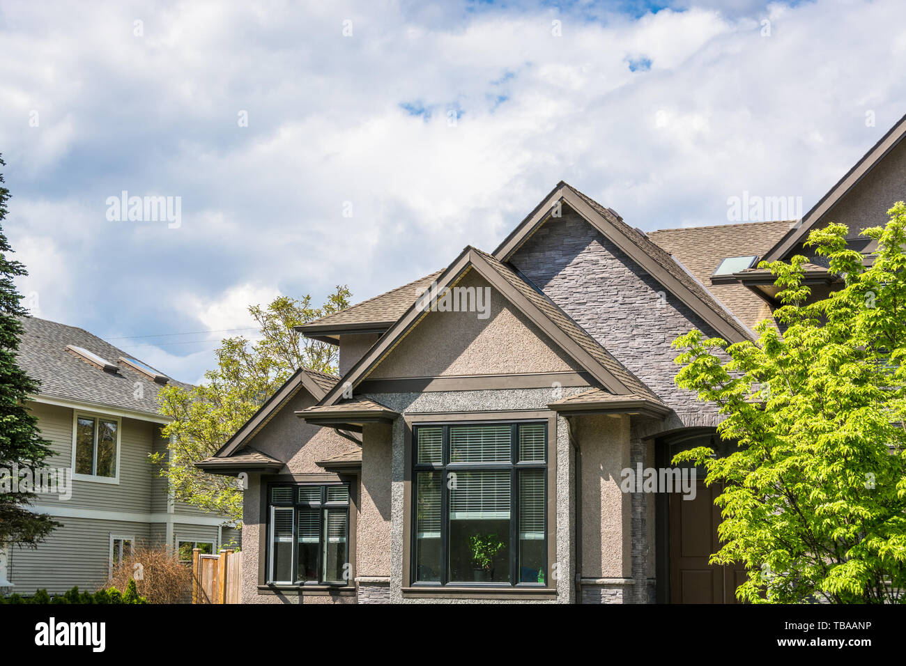 Top of residential house on cloudy sky background Stock Photo - Alamy