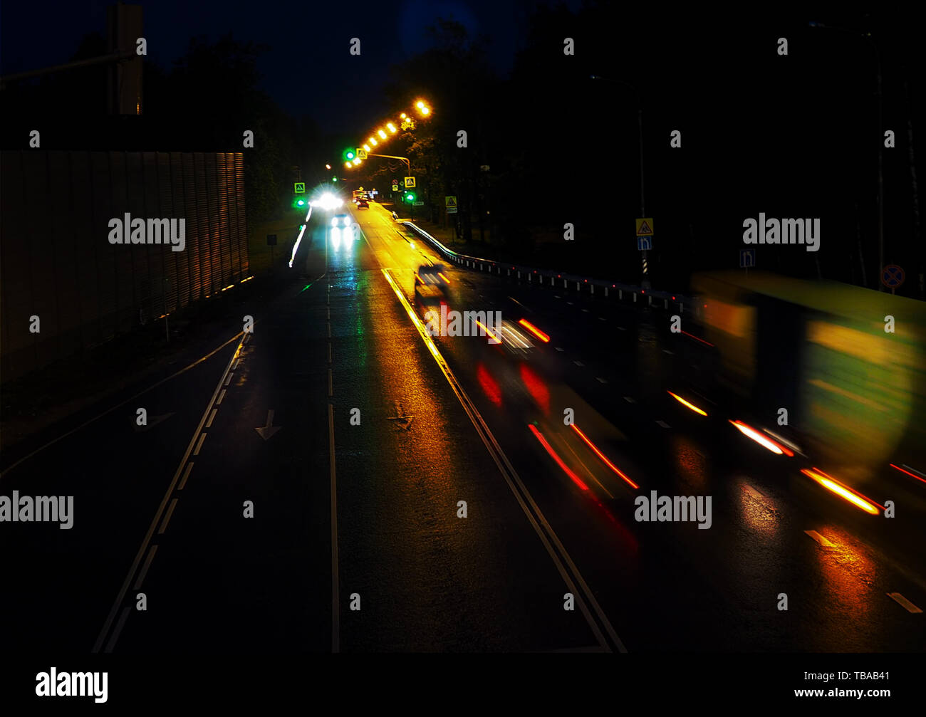 Driving on the night road Stock Photo - Alamy