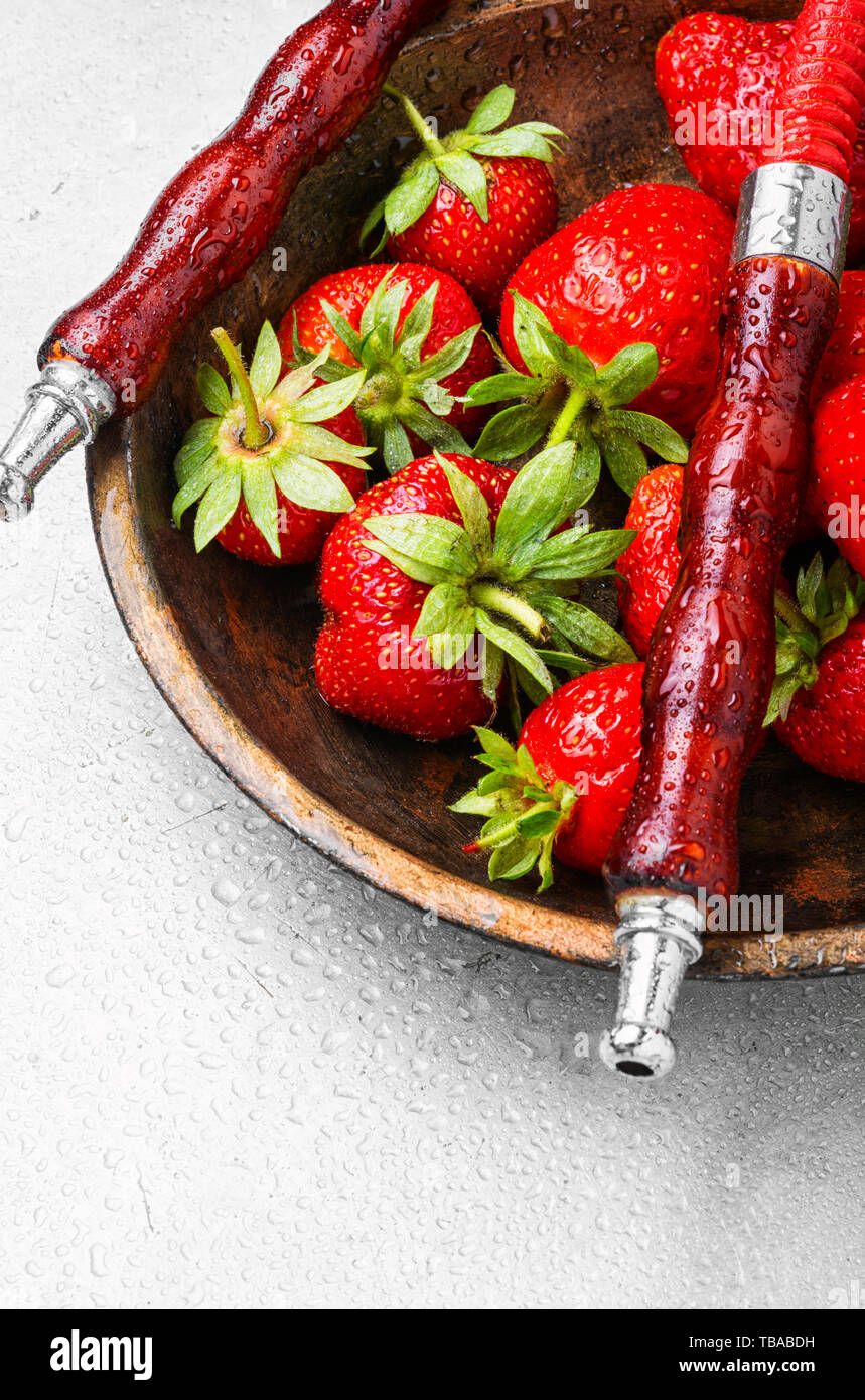 Oriental hookah with strawberry flavor.Turkish shisha with berry ...