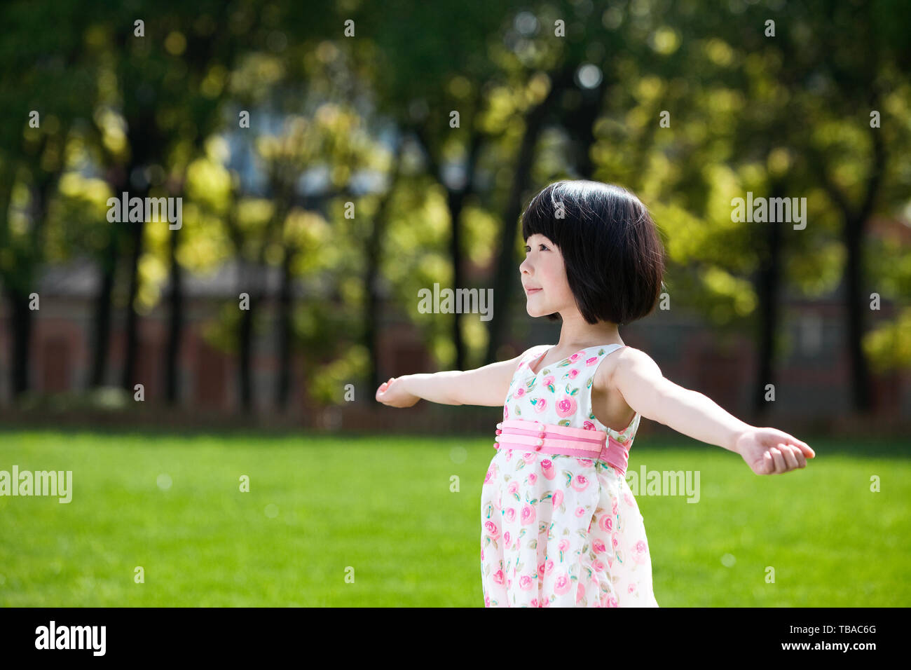 a girl playing outdoors Stock Photo - Alamy