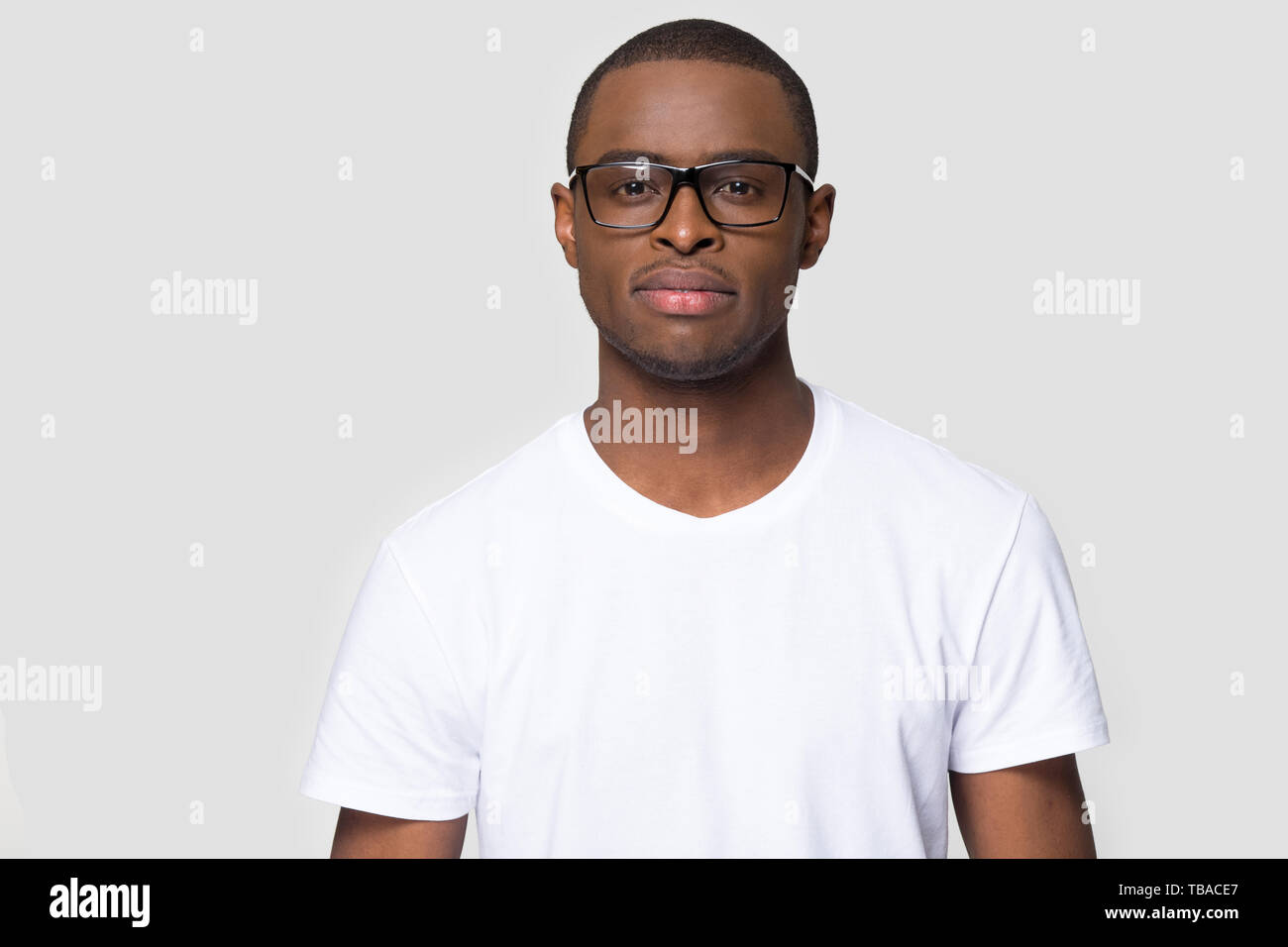 Male college student wearing glasses hi-res stock photography and ...
