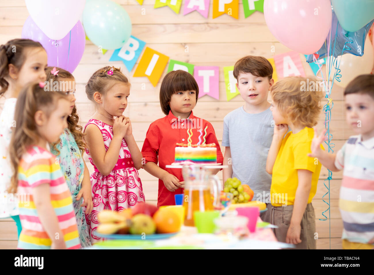 Group of children celebrate birthday party together Stock Photo - Alamy