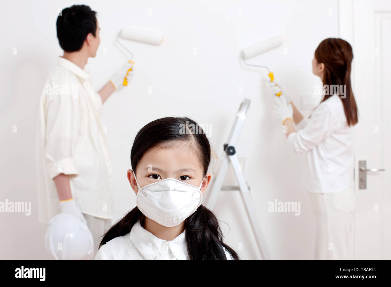 Kids help decorate the new house Stock Photo - Alamy