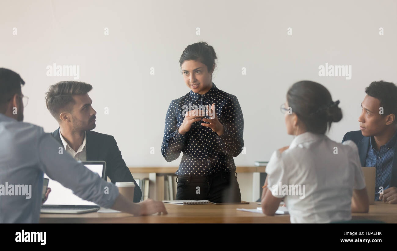 Female indian coach hold meeting brainstorming with employees Stock ...