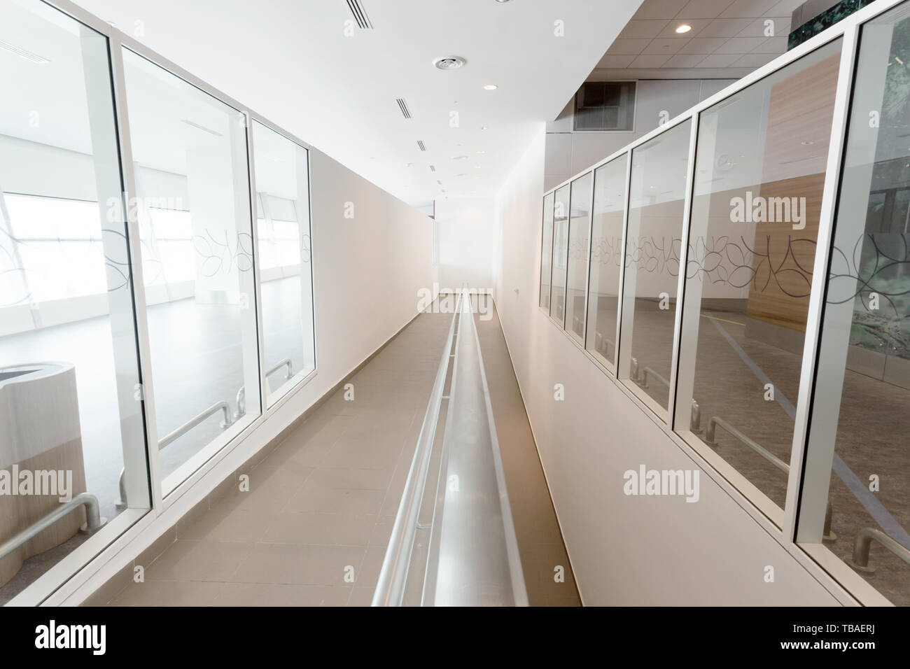Modern office corridor with wheelchair pathway Stock Photo - Alamy