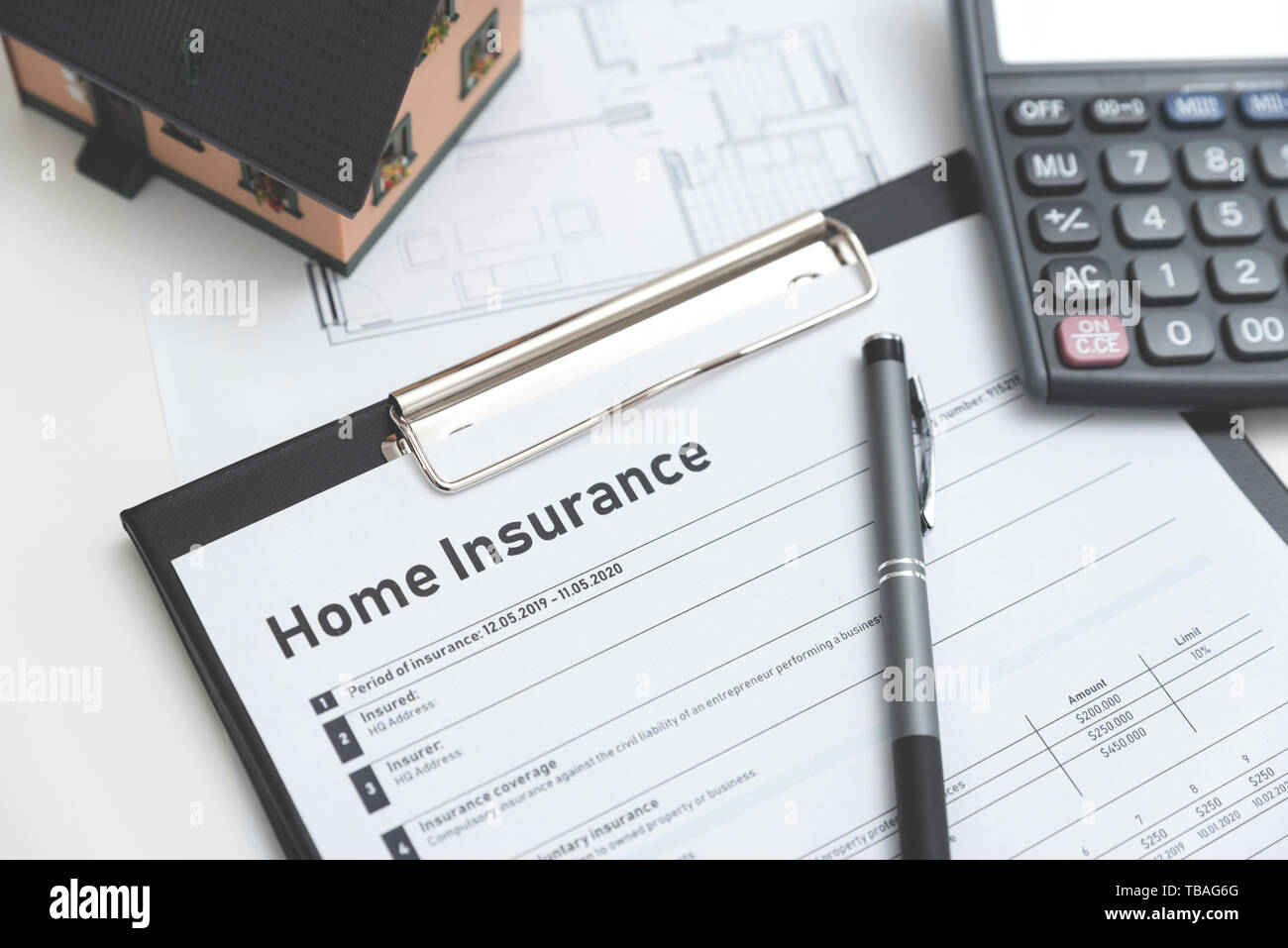 Home insurance form on the table. Assurance and home safety concept ...