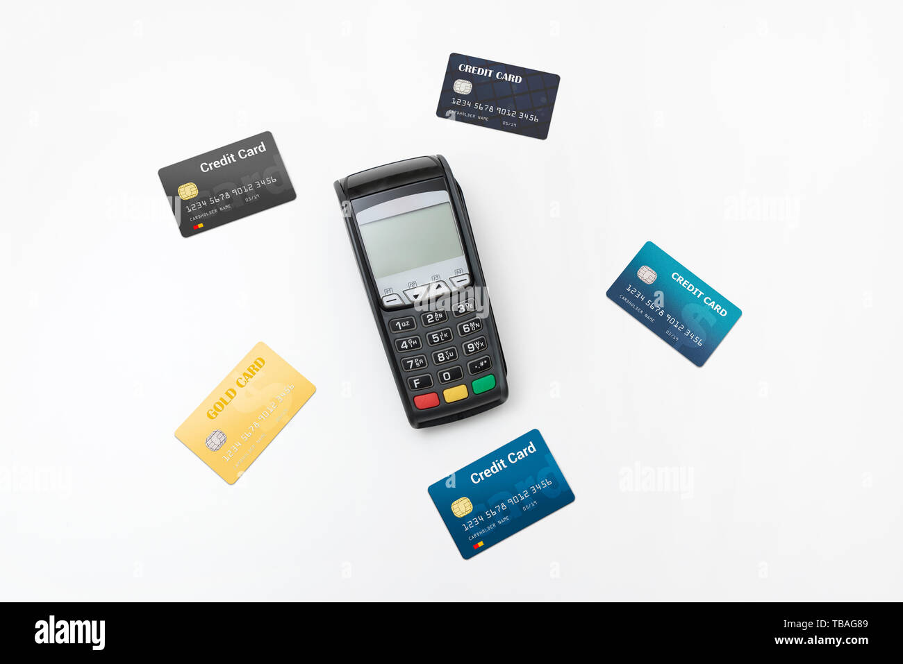 Payment terminal, credit card machine with some credit cards top view ...