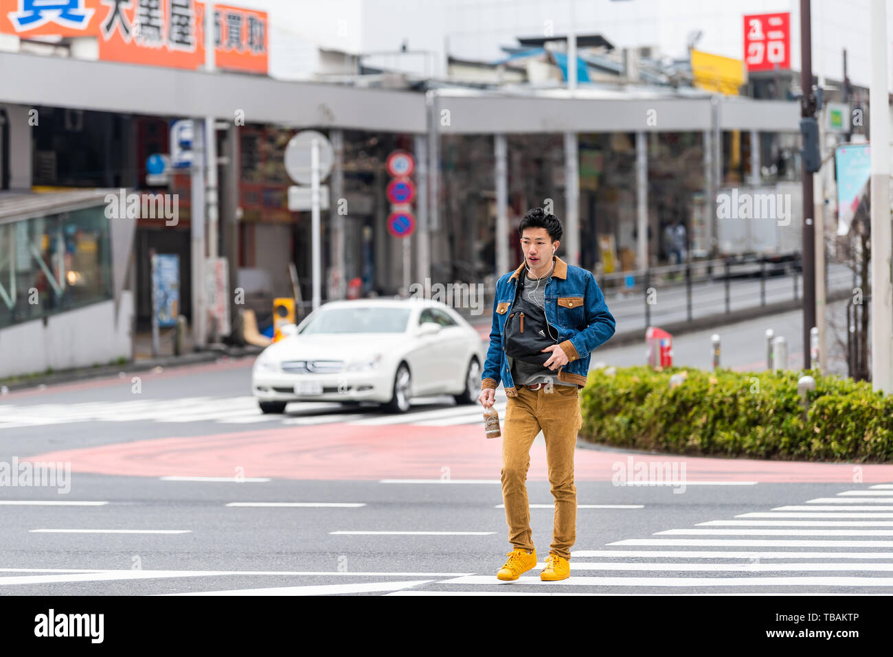 Tokyo, Japan - March 30, 2019: Shinjuku street sidewalk near station ...