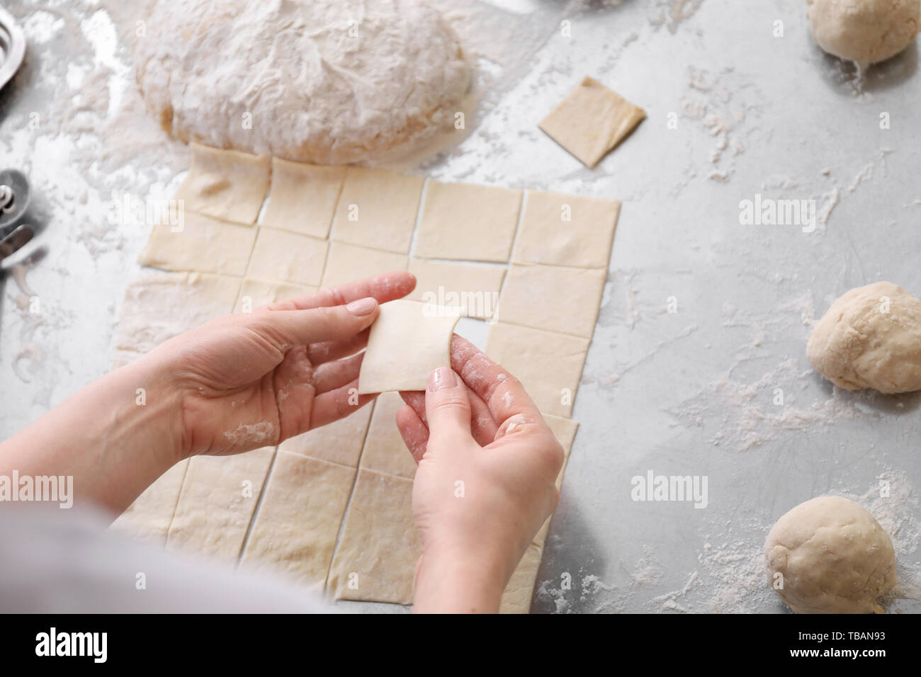 Female baker making cookies in kitchen Stock Photo - Alamy