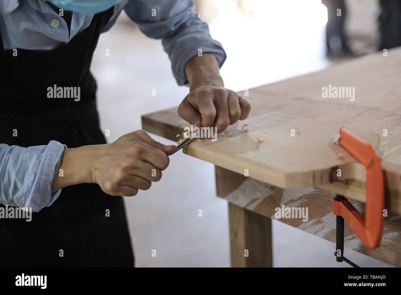 A dedicated young woodworking craftsman Stock Photo - Alamy
