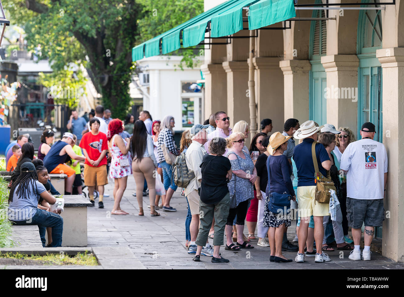 New Orleans, USA - April 23, 2018: People standing in line queue during ...