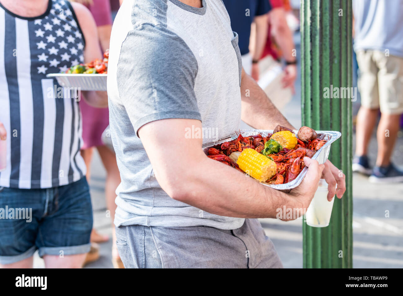 New Orleans, USA Louisiana city town with people eating seafood ...