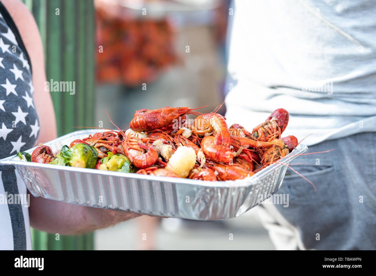 New Orleans, USA Louisiana town with people by restaurant eating ...