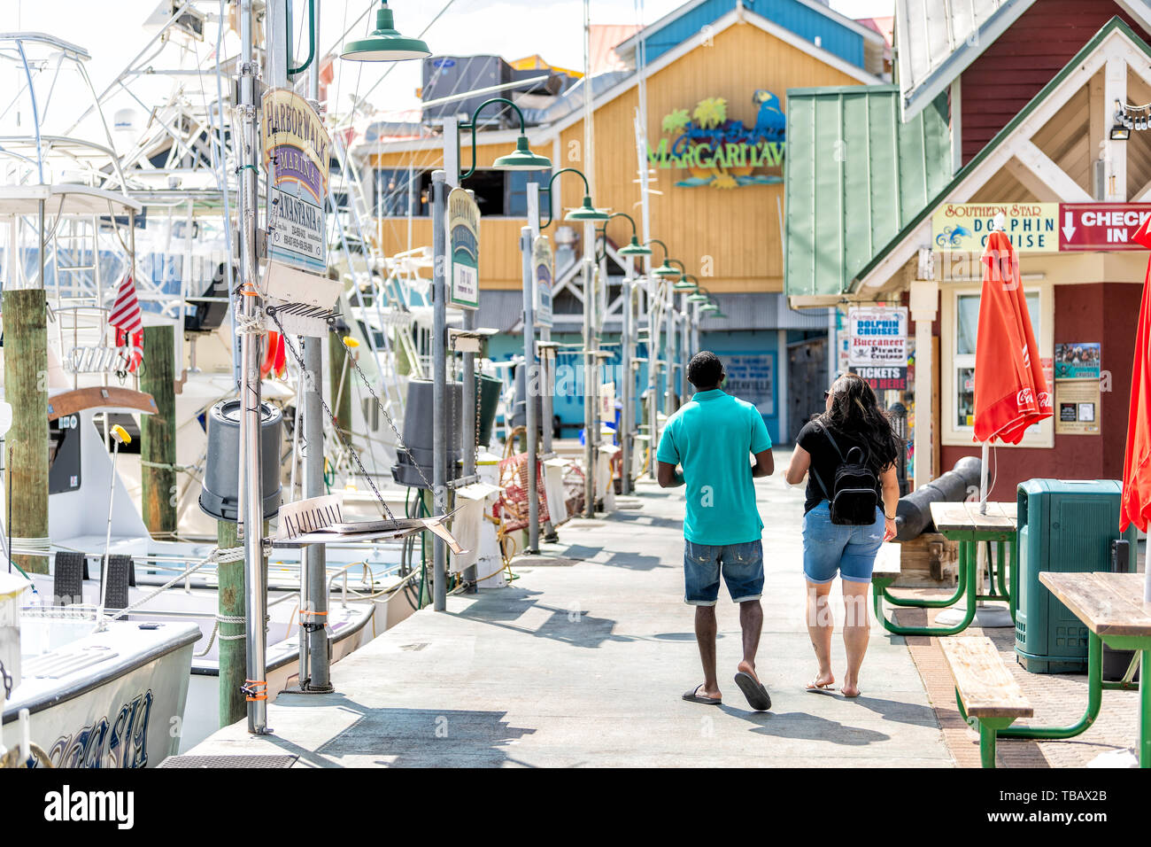 Destin, USA - April 24, 2018: City town Harborwalk village boardwalk at ...