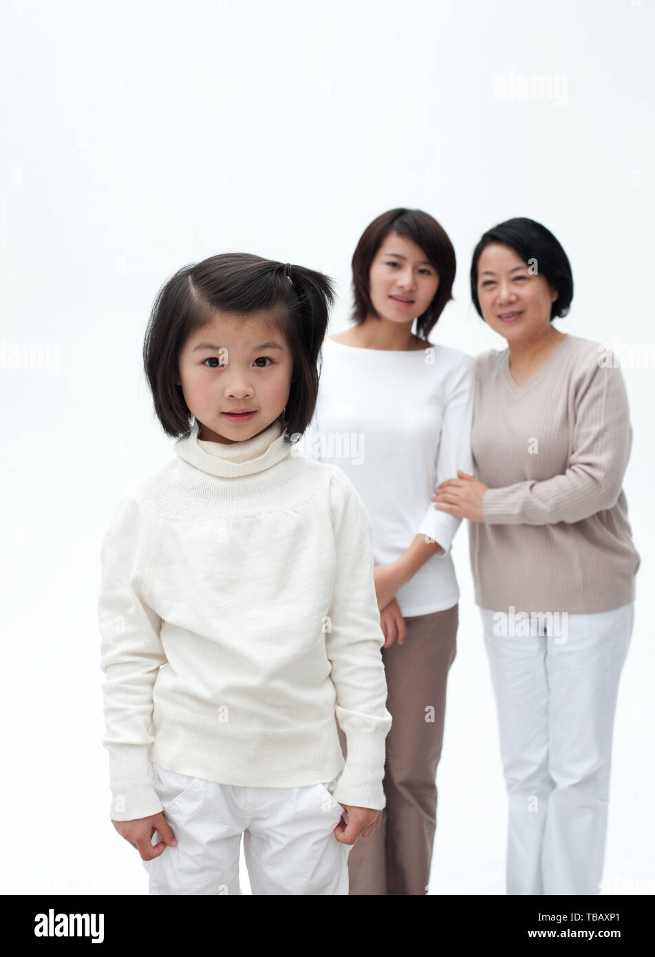 Three women facing camera hi-res stock photography and images - Alamy