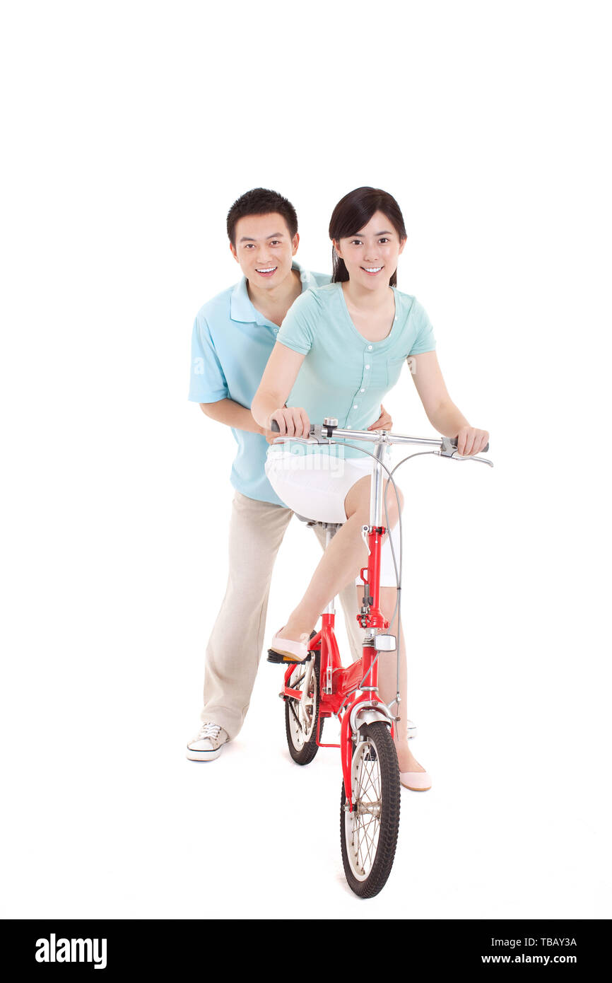Couple man woman cycling Cut Out Stock Images & Pictures - Alamy