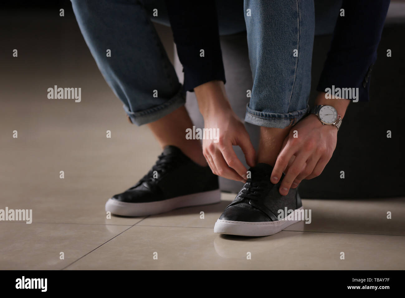 Man putting on shoes hi-res stock photography and images - Alamy