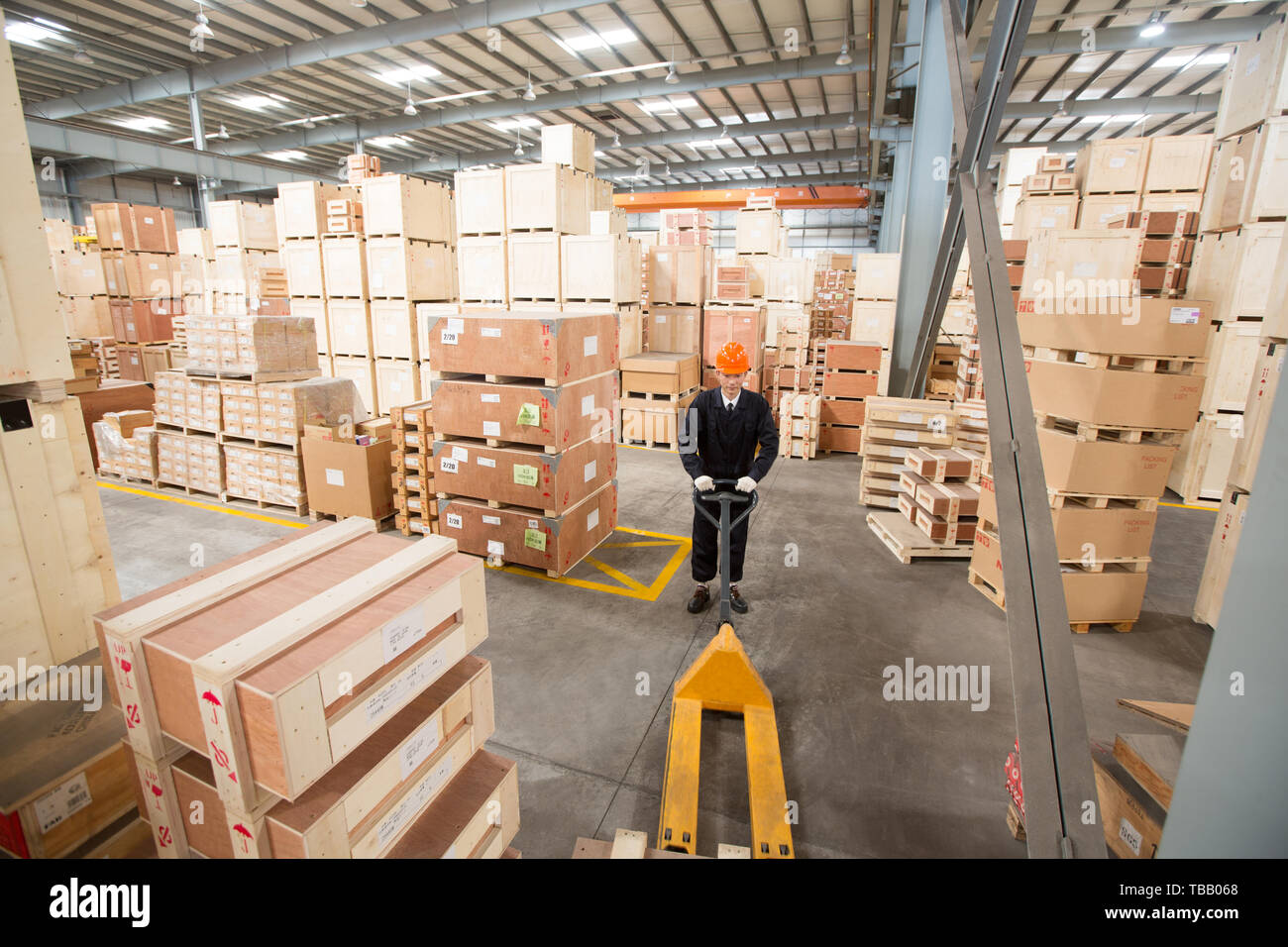 Logistics personnel load and unload cargo at the warehouse Stock Photo ...