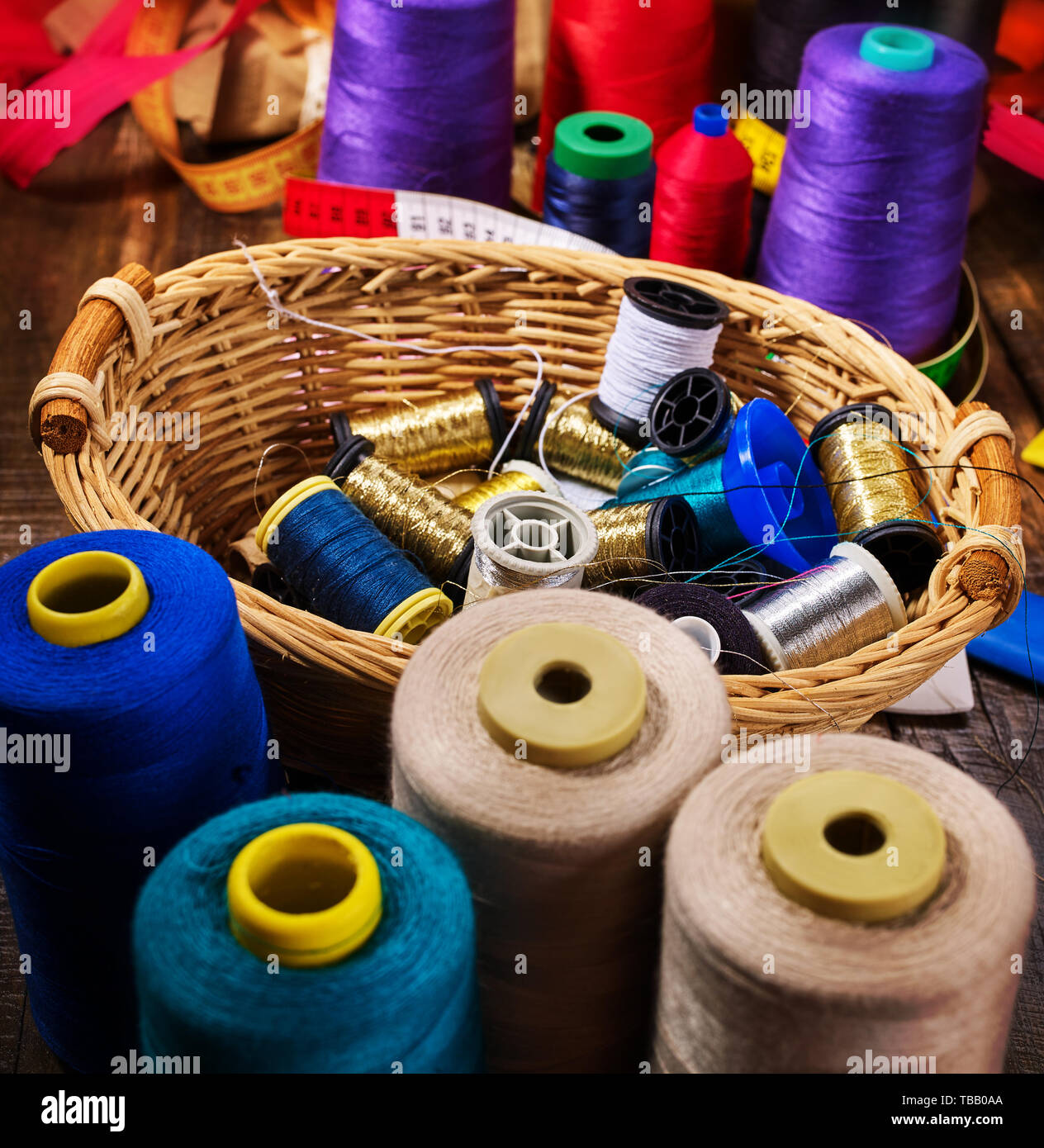 Sewing accessories coil threads and measuring tape in basket supplies ...