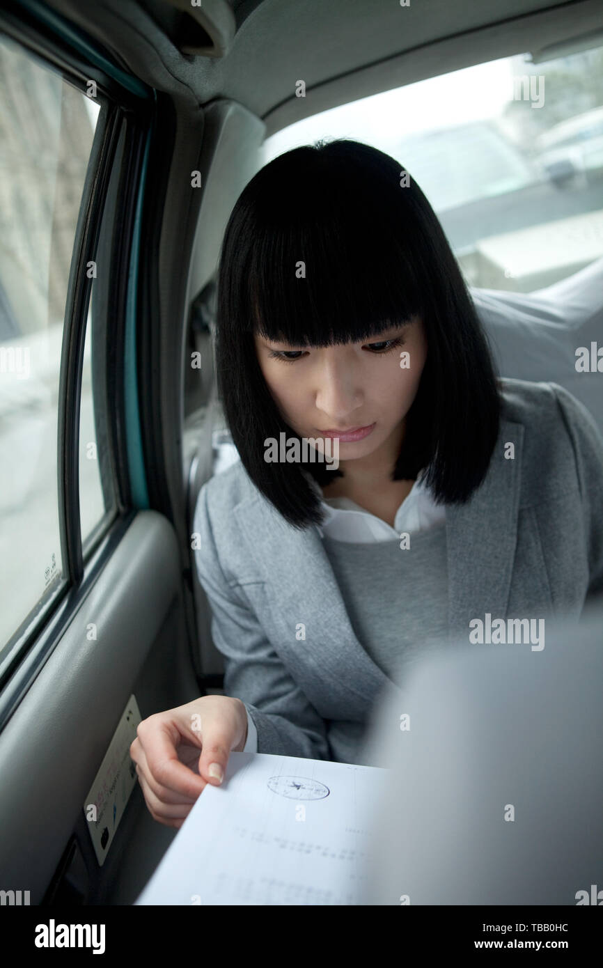 A white-collar woman in the car Stock Photo - Alamy