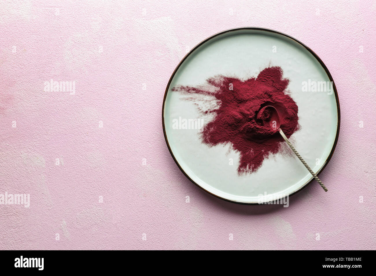 Plate with acai powder on color background Stock Photo - Alamy