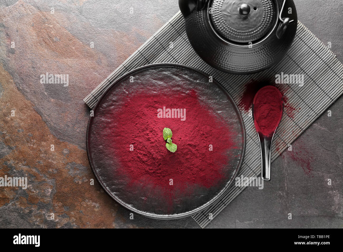 Plate with acai powder and teapot on table Stock Photo - Alamy